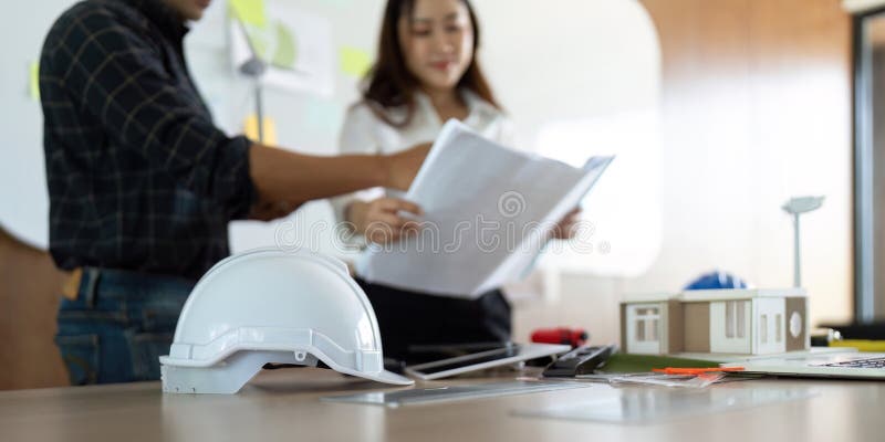 Sustainability in Engineering. Engineers Discussing Project Plans for ...