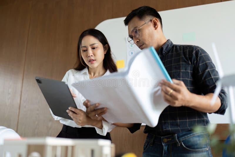 Sustainability and Engineering. Team of Engineers Discussing Eco ...