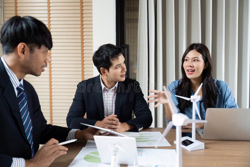 Sustainability and ESG. Diverse Team Collaborating on Renewable Energy ...