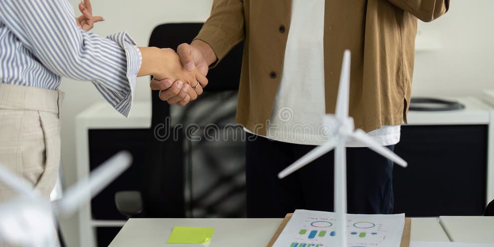 Sustainability Teamwork: Professionals Shaking Hands on Eco-friendly ...