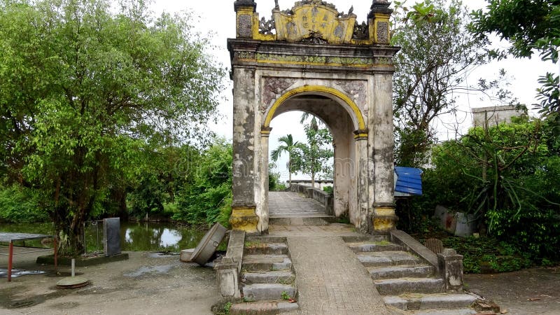 The Sustainable Village Gate With Time Stock Photo - Image of yellow ...