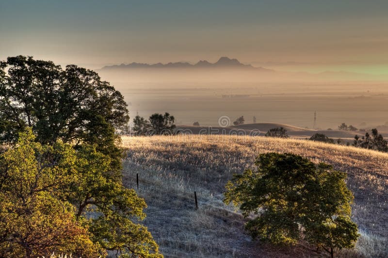 Sutter Buttes Sunrise stock image. Image of backlit, central - 26712311