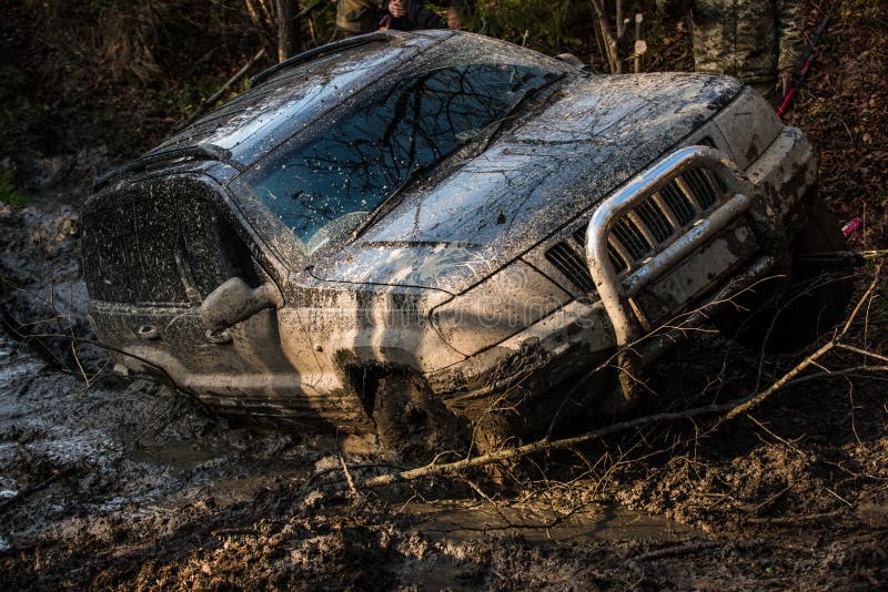 SUV Covered with Mud on Path with Deep Rut. Stock Photo - Image of ...