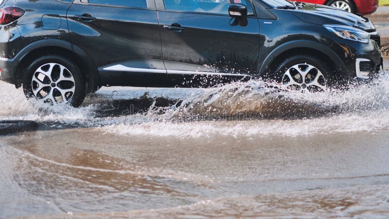 Suv Navigating Deep Water Puddle, Spraying Liquid Forcefully during ...
