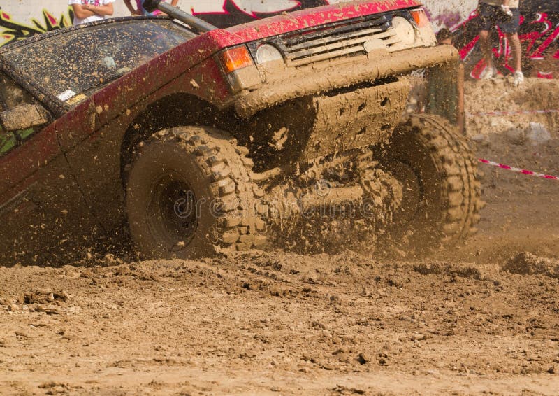 SUV out of mud stock photo. Image of helmet, vehicle - 30385098