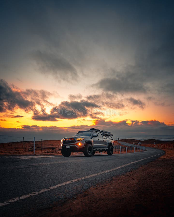 SUV at Sunset, Illuminated by the Warm Golden Rays of the Setting Sun ...