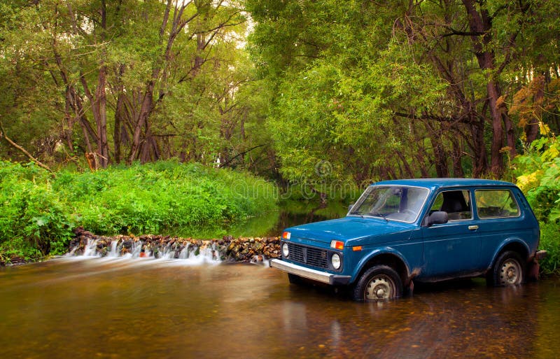 SUV and waterfall stock image. Image of parked, tree - 22872241