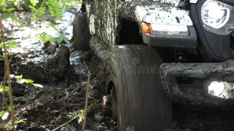 The SUV Wiggles in Deep Mud, Spinning All Wheels Stock Video - Video of ...