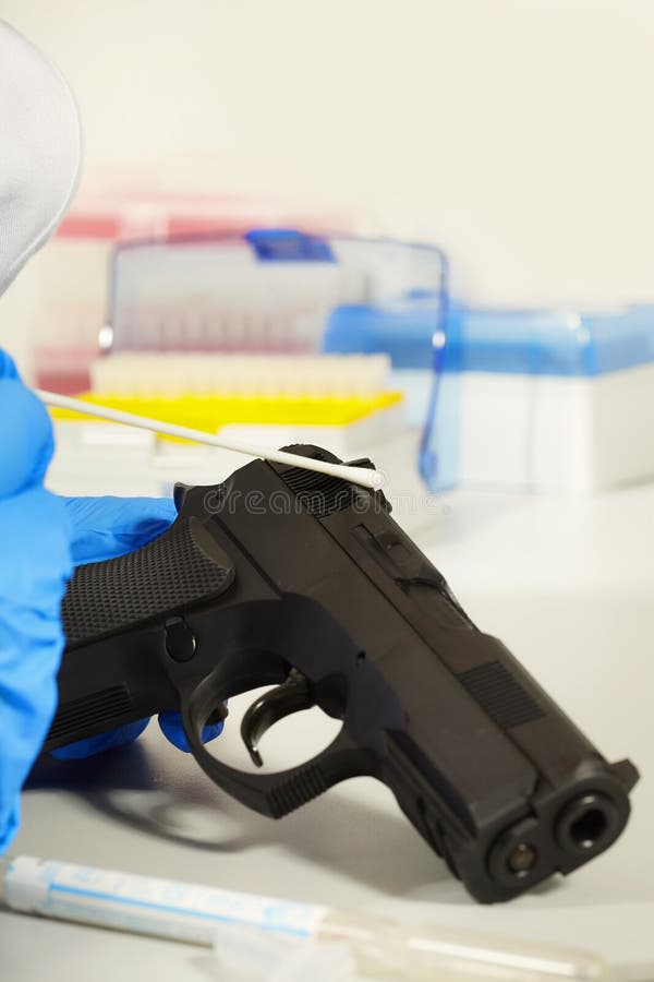 Swabbing Sample of DNA from Handgun Stock Image - Image of handgun ...