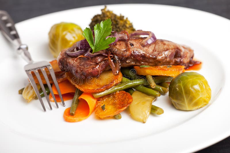 A Swabian Meal of Spaetzle or Spaetzli with Fried Spareribs, Munich ...