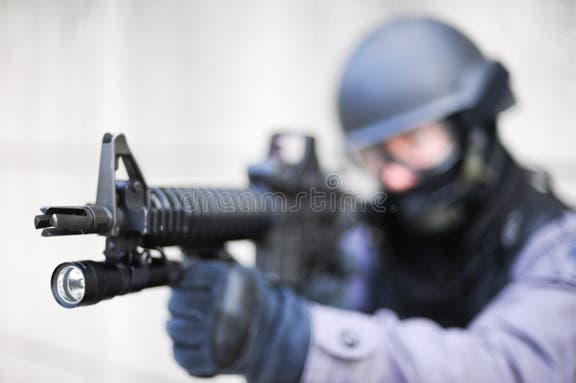 SWAT Officer with Gun stock photo. Image of strength - 18427798