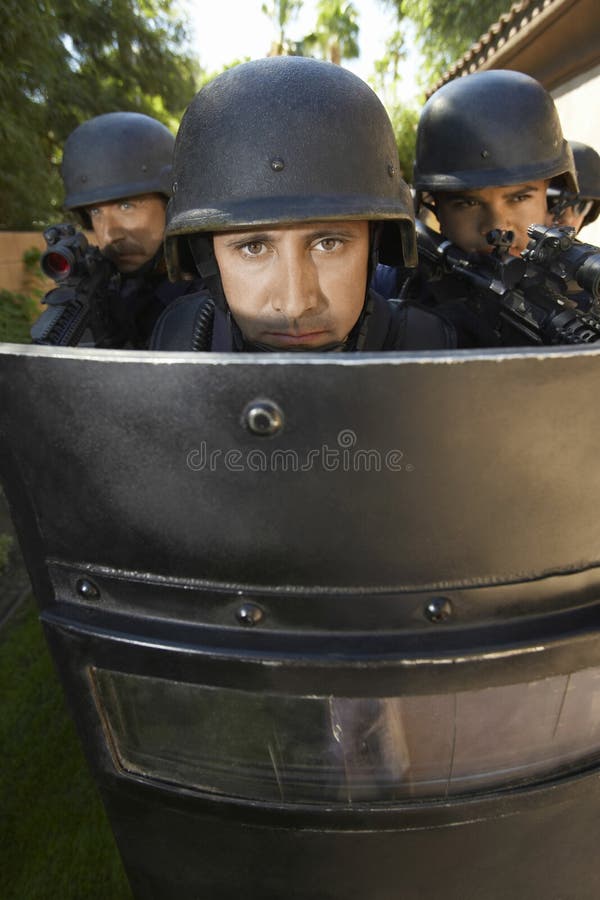 Swat Officers Behind Shield Stock Photo - Image of coworker, outdoors ...
