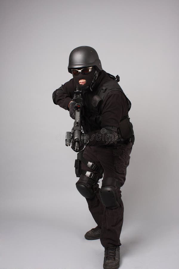 Swat Police Officer Pointing a Gun at the Camera, Isolated on White ...