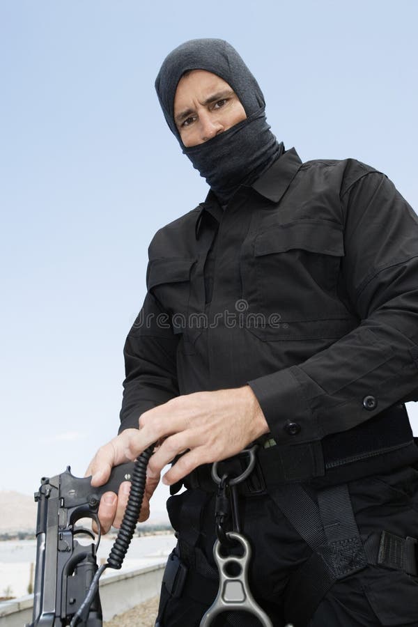 SWAT Team Officer Rappelling and Aiming Gun Stock Image - Image of ...