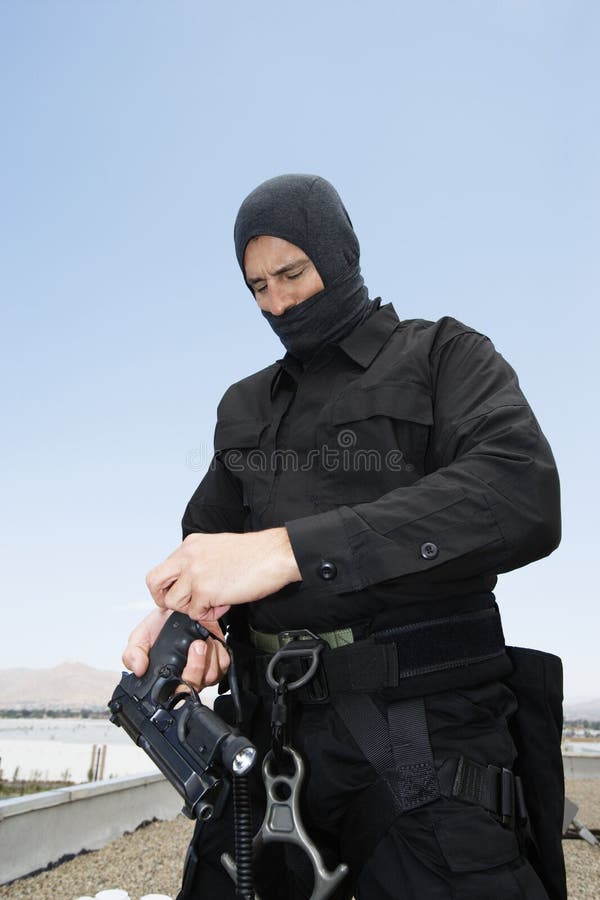 SWAT Team Officer Loading Pistol Stock Photo - Image of outdoors ...
