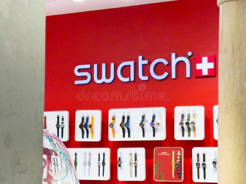 Swatch Watches Display on Red Wall with Logo Signage Editorial Stock ...