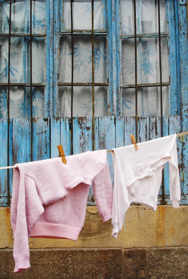 Sweater and T-shirt Hanging on a Clothes Line Stock Photo - Image of ...