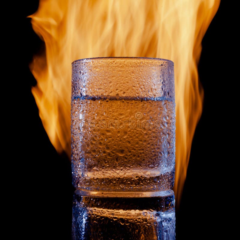 Sweating Glass of Water on Fire on a Black Background Stock Photo ...