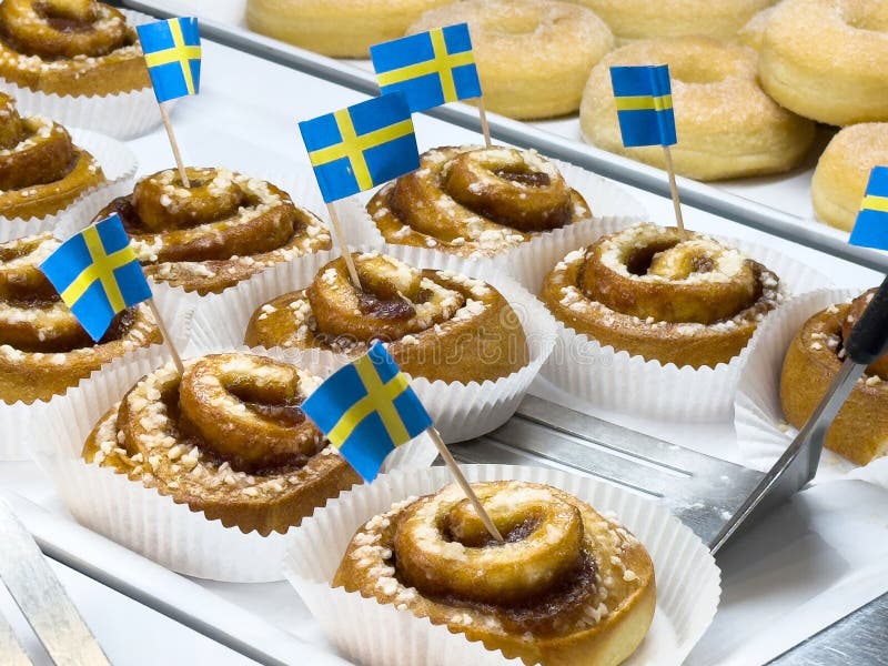Swedish Cinnamon Rolls with Flags on Display at Bakery Editorial ...