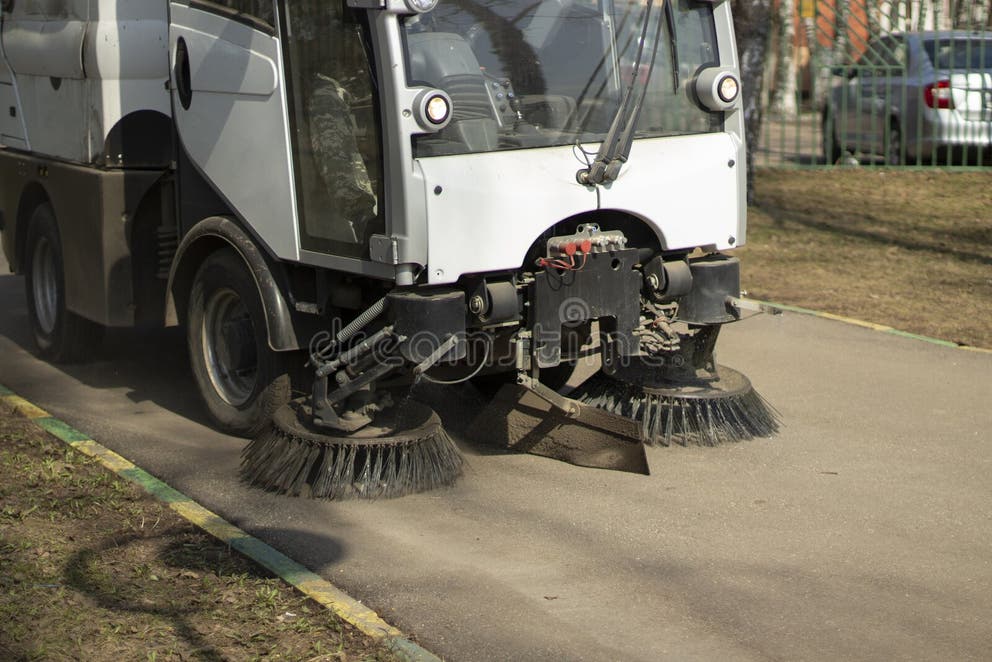 The Sweeper is Sweeping the Asphalt. Cleaning the Path with a Cleaning ...