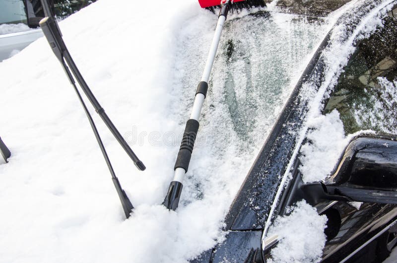Sweeping snow for car stock photo. Image of silence - 175191564