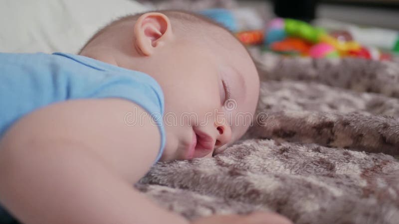 A Sweet Baby Sleeping in Bed. Stock Video - Video of baby, face: 124924373