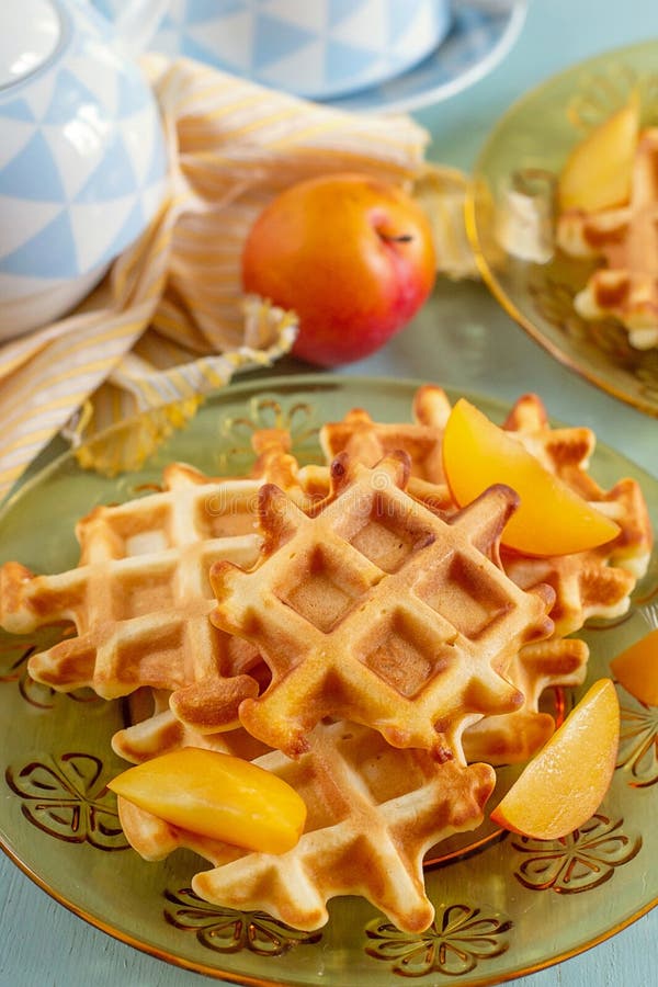 Sweet Fluffy Classic Waffles Served with Plums Stock Photo - Image of ...
