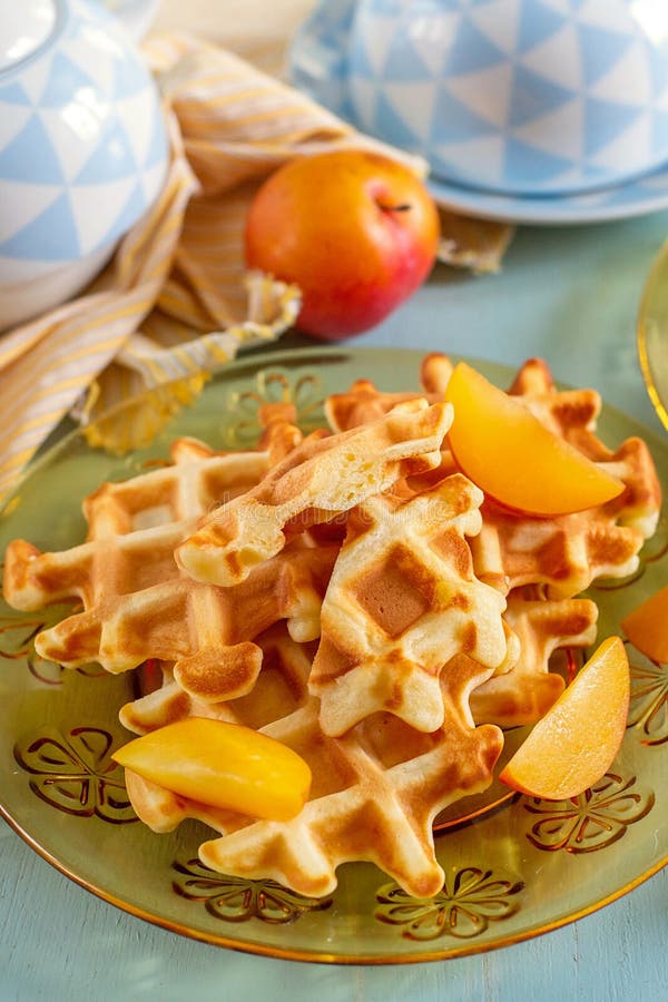 Sweet Fluffy Classic Waffles Served with Plums Stock Photo - Image of ...