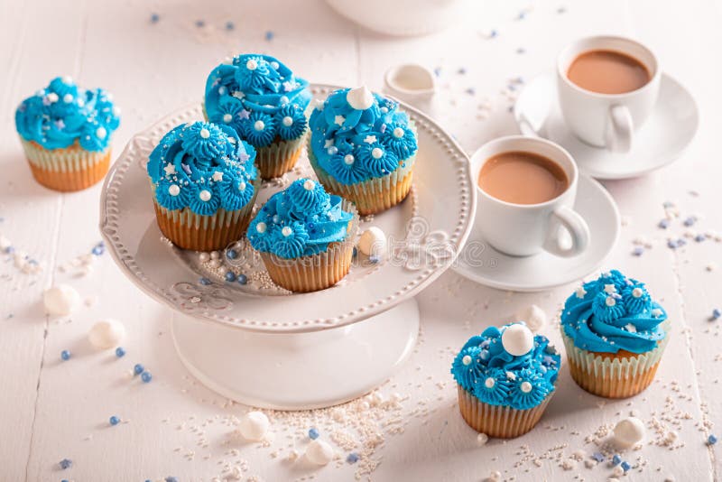 Sweet Blue Cupcakes with Flower Shaped Cream Stock Photo - Image of ...