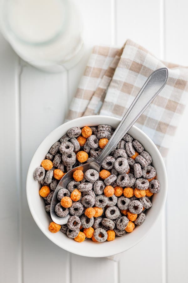 Sweet Breakfast Cereals in Bowl on White Table. Top View Stock Photo ...