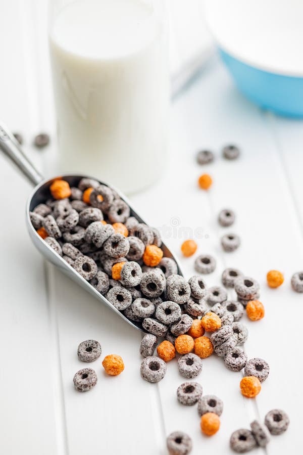 Sweet Breakfast Cereals in Scoop on White Table Stock Photo - Image of ...