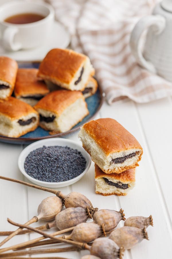 Sweet Bun with Poppy Seed on White Table Stock Photo - Image of sweet ...
