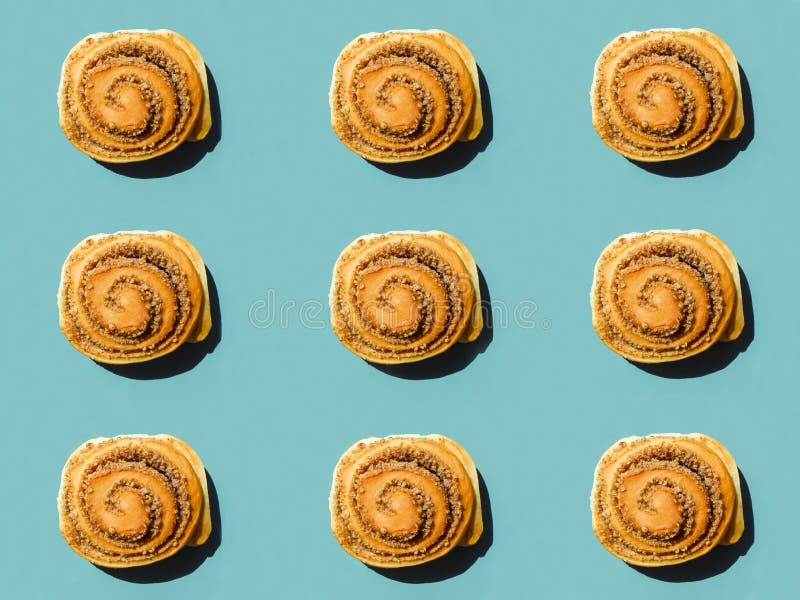 Sweet Buns Isolated on Blue. Top View. Sweet Cinnamon Rolls Pattern ...