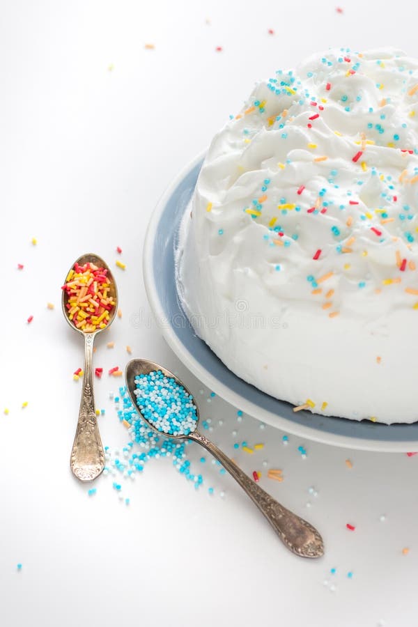 Sweet Cake with Blue, Yellow, Red and White Sprinkles Stock Photo ...