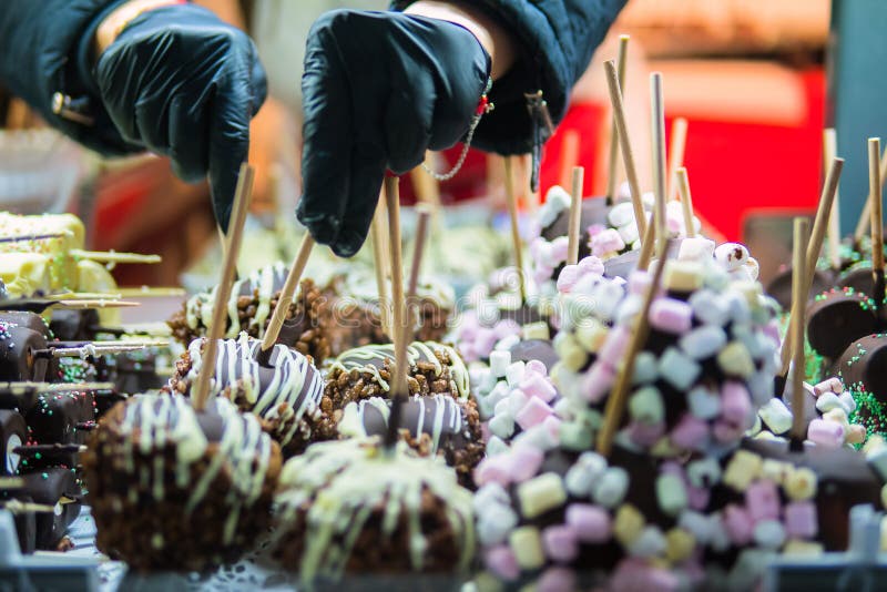 Sweet Candy in Chocolate on a Stick. Sweets for Children. Apples in ...