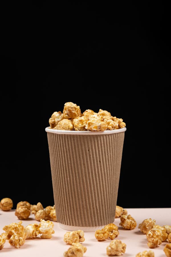Sweet Caramelized Popcorn in a Bucket. Black Background Stock Photo ...