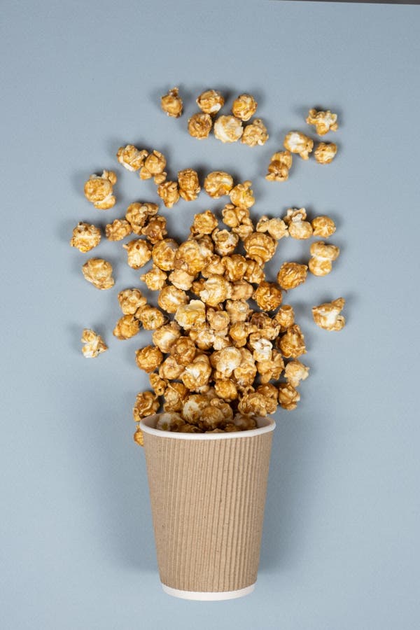 Sweet Caramelized Popcorn Spilled Out of the Glass. Stock Photo - Image ...
