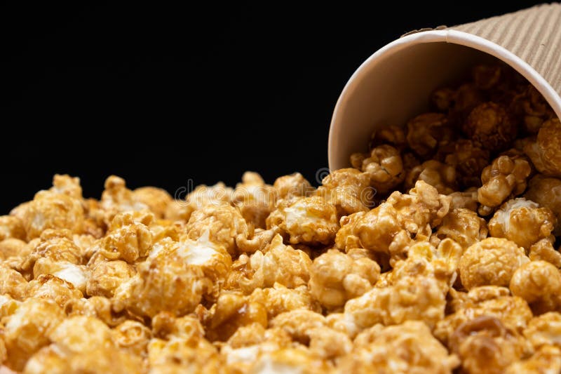 Sweet Caramelized Popcorn Spilled Out of the Glass. Stock Image - Image ...