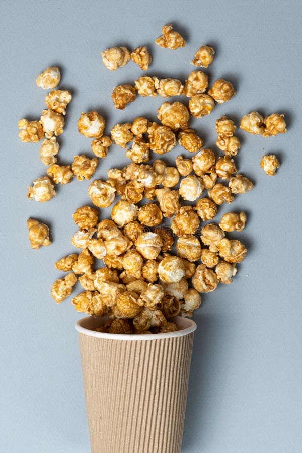 Sweet Caramelized Popcorn Spilled Out of the Glass. Stock Photo - Image ...