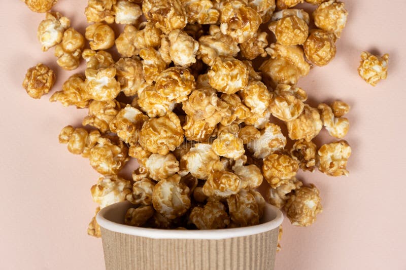 Sweet Caramelized Popcorn Spilled Out of the Glass. Stock Photo - Image ...