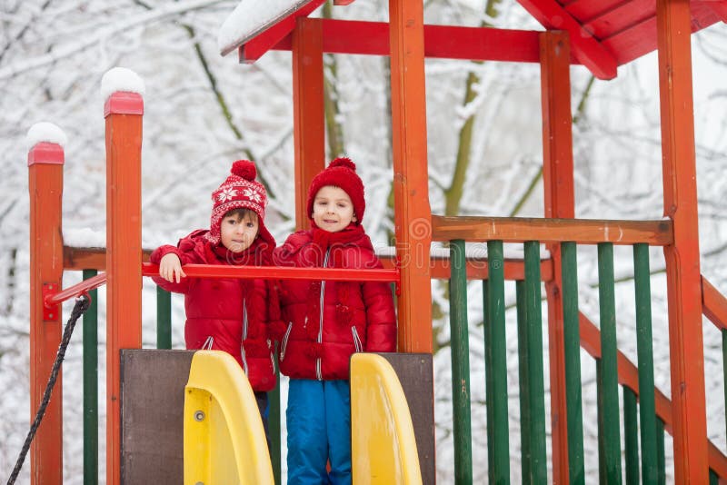 Sweet Children, Playing in the Snow on the Playground Stock Photo ...