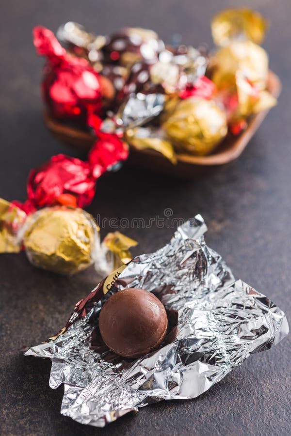 Sweet Chocolate Candy Wrapped in Foil on Kitchen Table Stock Image ...