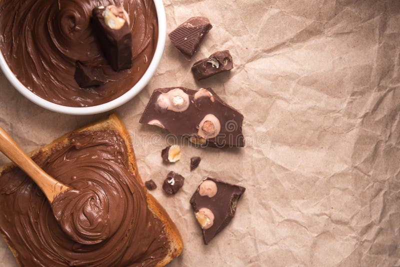 Chocolate Spread on Slice of Bread with Spoon, Melted Cream White Bowl ...