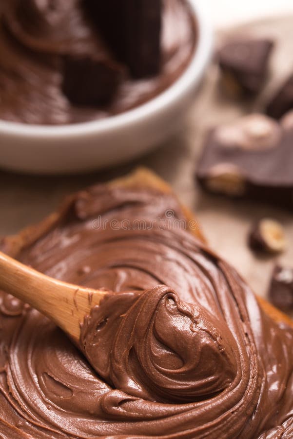 Chocolate Spread on Slice of Bread with Spoon, Melted Cream White Bowl ...