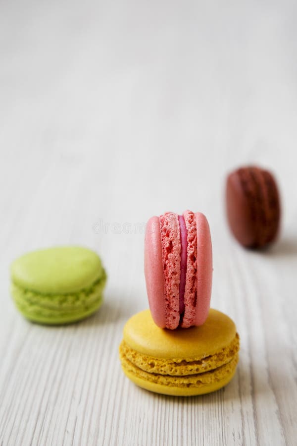 Sweet and Colorful Macarons on a White Wooden Table, Side View ...