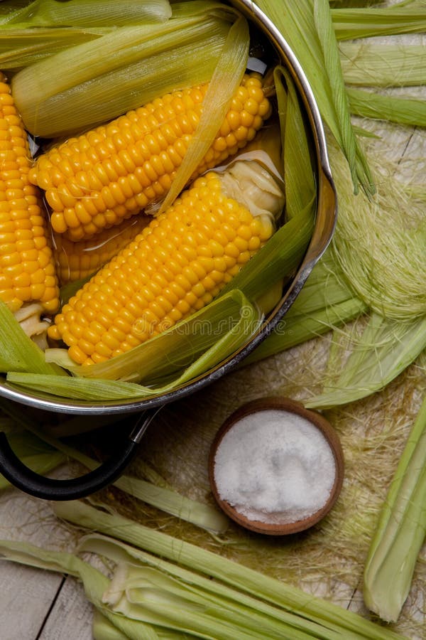 Sweet Corn Boil with Salt. Cooked Sweet Corn in Pot on Wooden Table ...