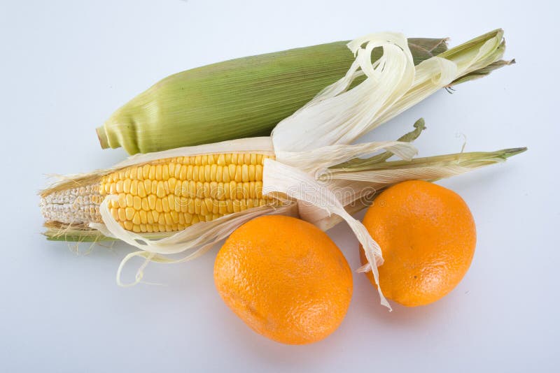 Sweet corn and orange stock image. Image of board, corn - 71624361