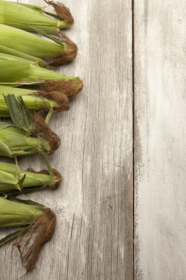 Sweet Corn on a Rustic Table Stock Photo - Image of place, background ...