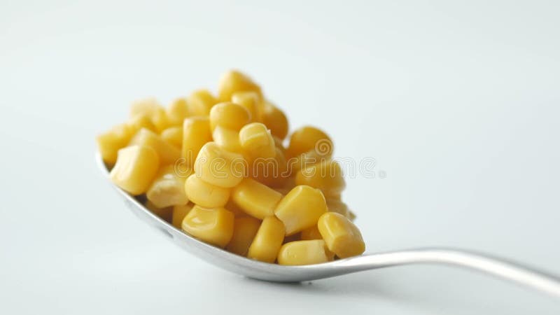 Sweet Corn on a Spoon on White Background Stock Footage - Video of ...