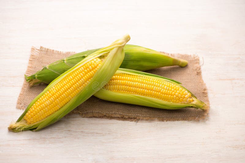 Sweet Corns. Fresh Corn on Cobs on Wooden Table. Stock Image - Image of ...